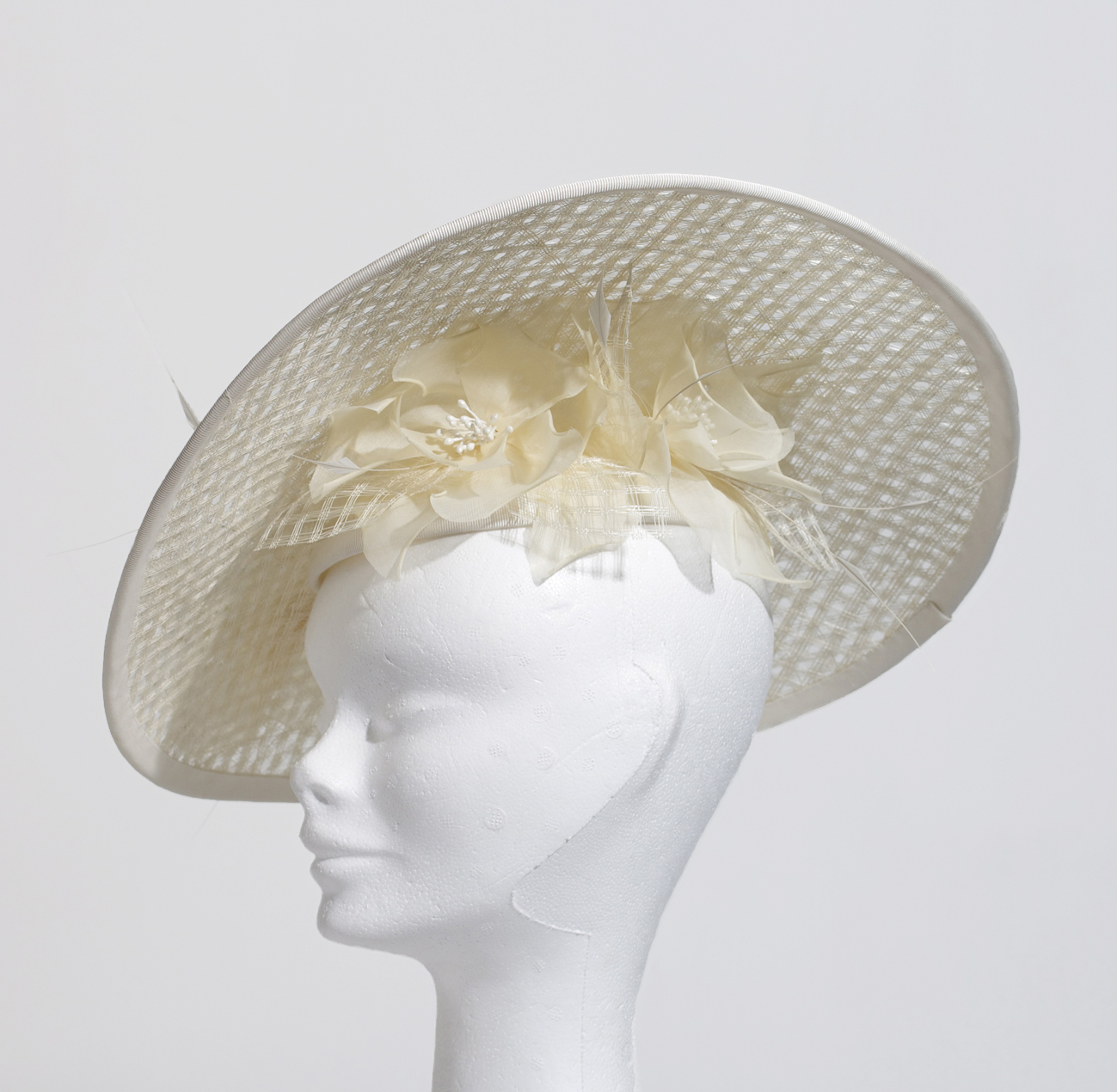 Cream window sinamay mid disc hat with cream flower trim and feathers ...