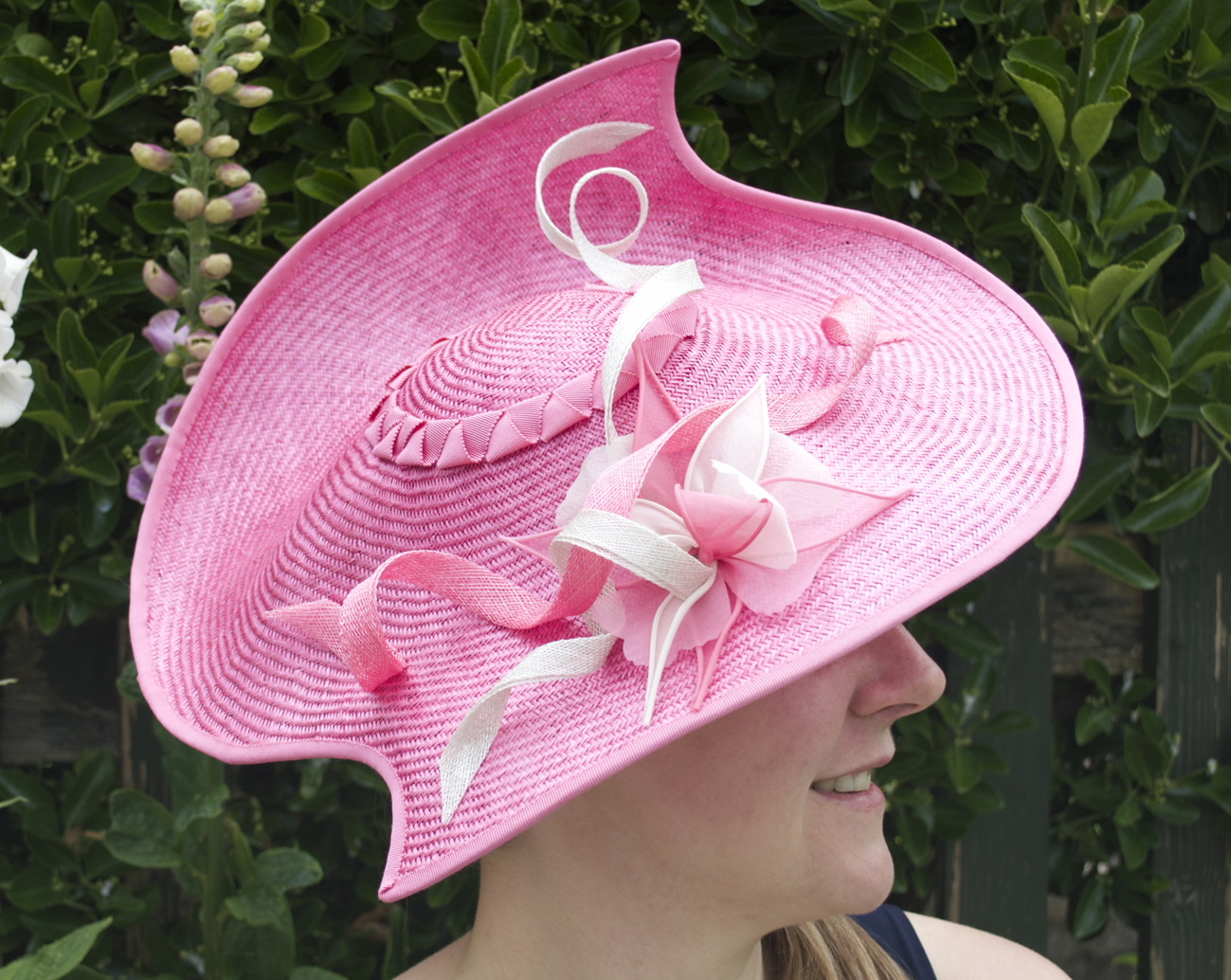 Pink two pointed straw tilt disc hat with cream and pink coil trim ...